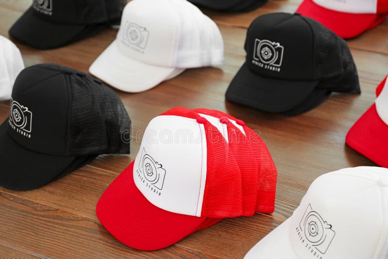Different Caps with Logo on Table Editorial Photography - Image of ...