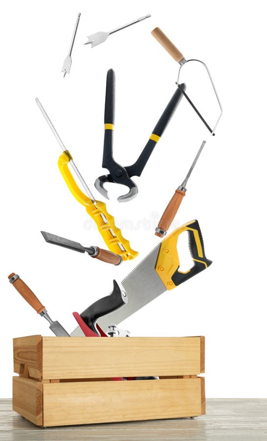 Different Carpenter`s Tools Falling into Wooden Box on White Background ...