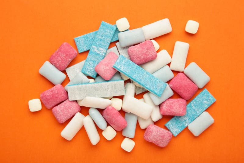 Different Chewing Gums on Orange Background Stock Image - Image of ...