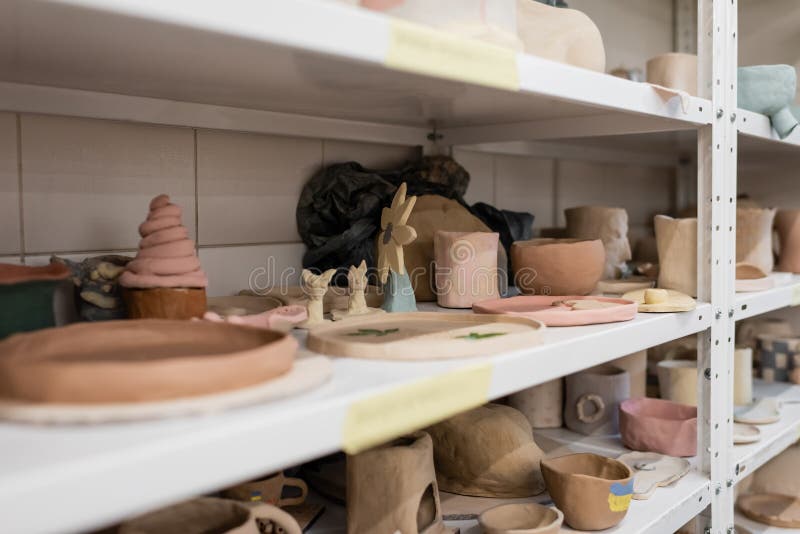 Different Clay Sculptures on Shelves of Stock Image - Image of ...