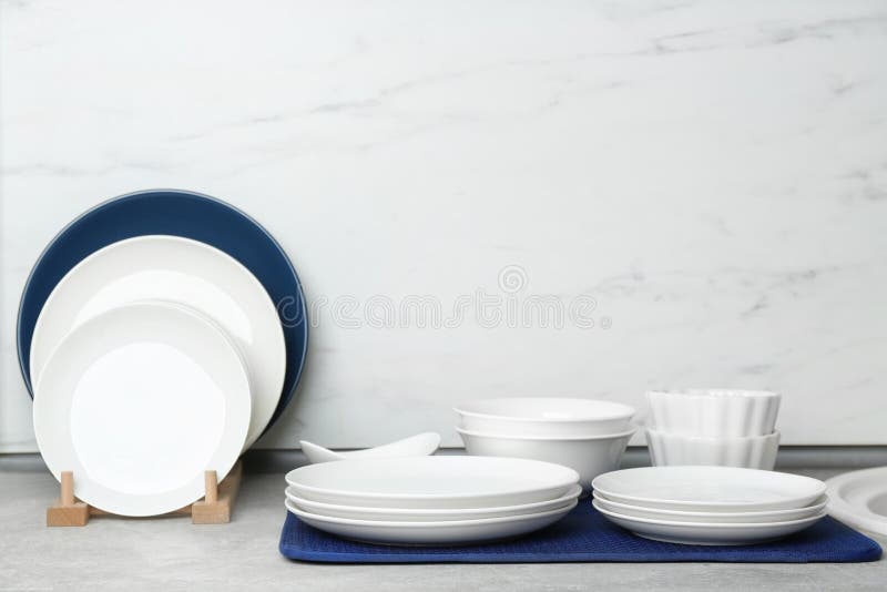 Different Clean Plates on Counter Stock Photo - Image of dinnerware ...