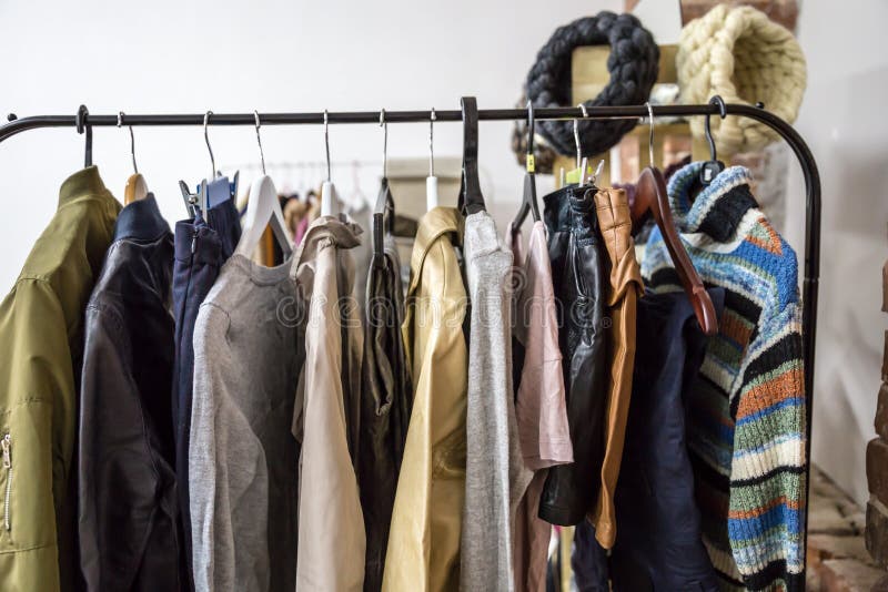 Different Clothes and Bags on the Shelves and Hangers Stock Photo ...