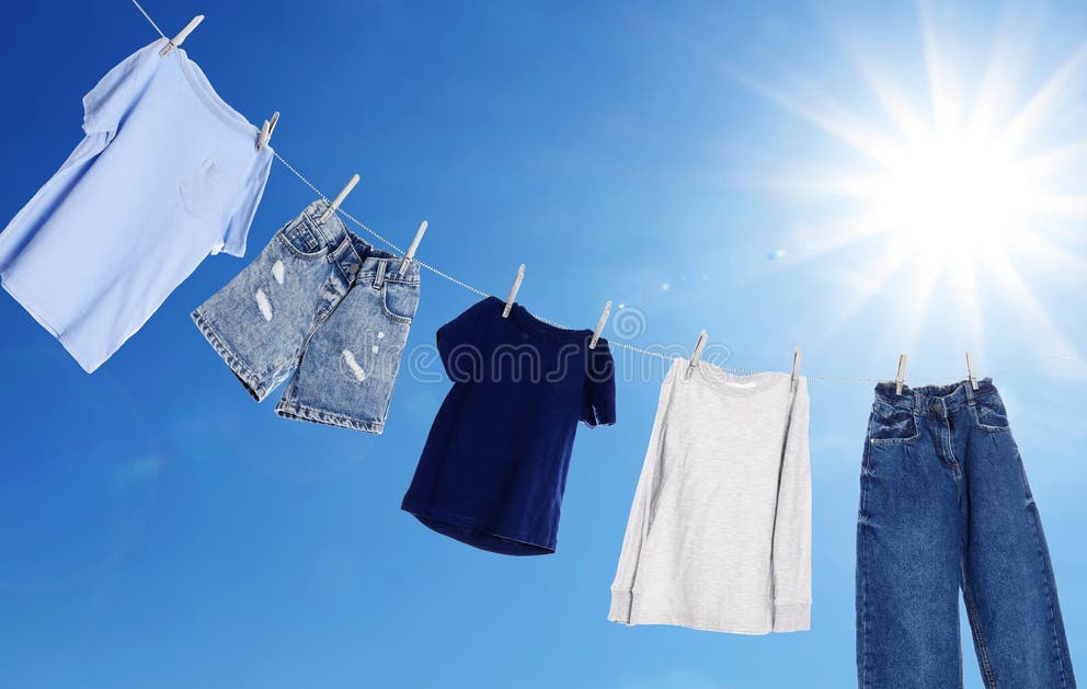 Different Clothes Drying on Washing Line Against Blue Sky Stock Image ...