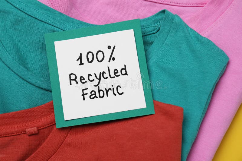 Different Clothes with Recycling Label, Closeup View Stock Photo ...