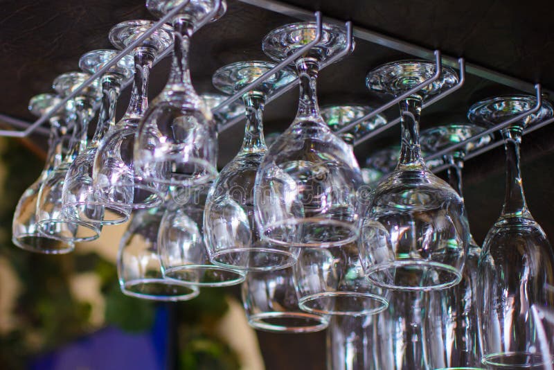 Different Cocktail Glasses Hanging Over a Bar Rack Stock Photo - Image ...