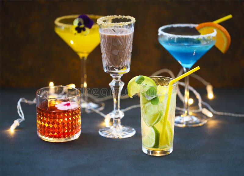 Different Cold Refreshing Cocktails on the Table Stock Image - Image of ...