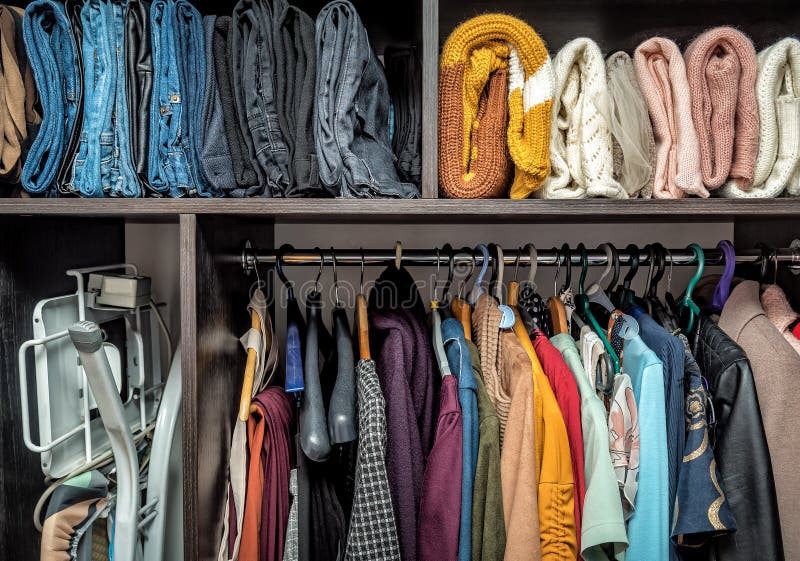 Different Color of Clothes in the Wardrobe Stock Photo - Image of ...