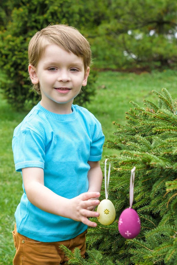 Different Color Easter Eggs in a Child`s Hands- Egg Hunt Stock Photo ...
