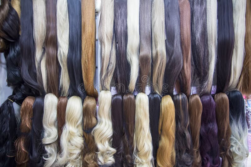 Different Color Human Hair Extensions in Wig Shop Stock Photo - Image ...