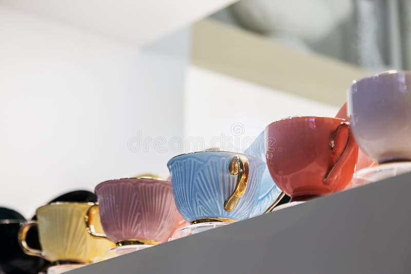 Different-colored Porcelain Cups are on the Counter Stock Image - Image ...