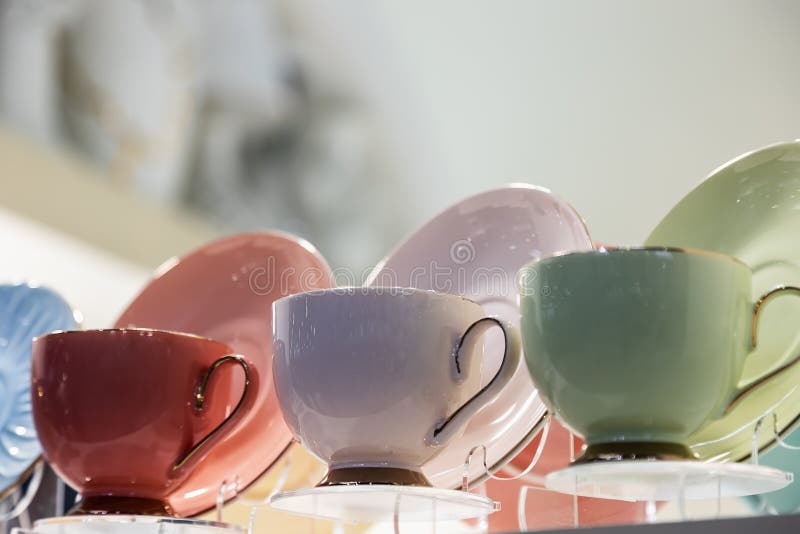 Different-colored Porcelain Cups are on the Counter Stock Photo - Image ...