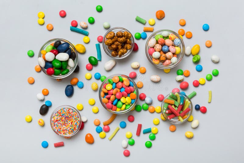 Different Colored Round Candy in Bowl and Jars. Top View of Large ...