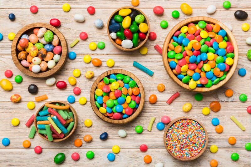 Different Colored Round Candy in Bowl and Jars. Top View of Large ...