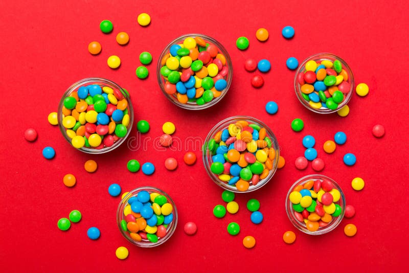 Different Colored Round Candy in Bowl and Jars. Top View of Large ...