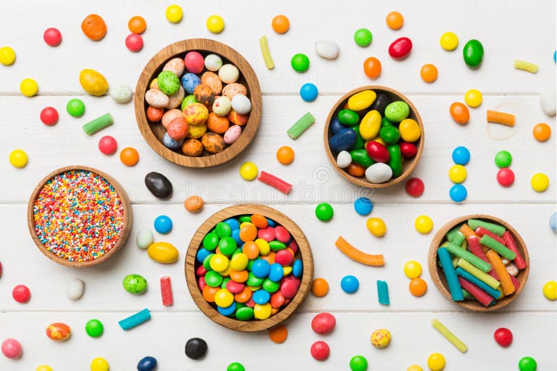 Different Colored Round Candy in Bowl and Jars. Top View of Large ...