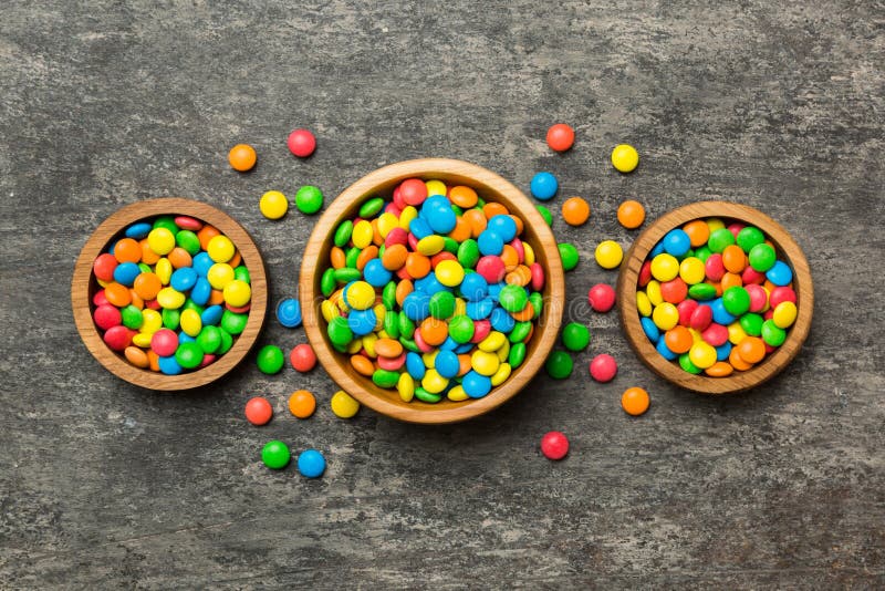 Different Colored Round Candy in Bowl and Jars. Top View of Large ...