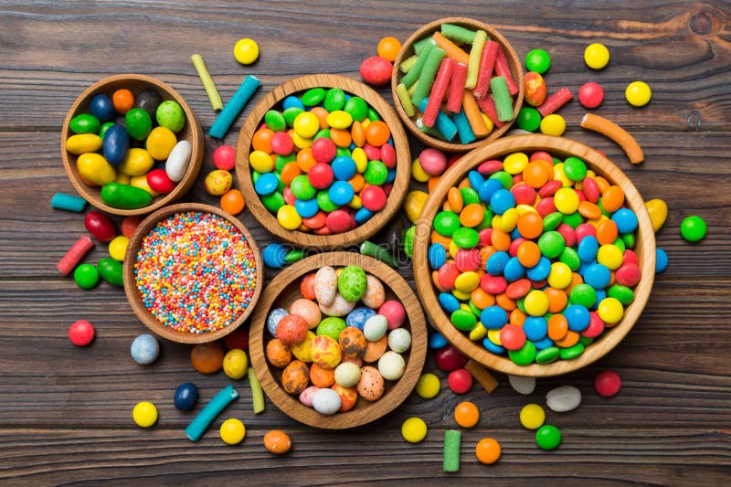 Different Colored Round Candy in Bowl and Jars. Top View of Large ...
