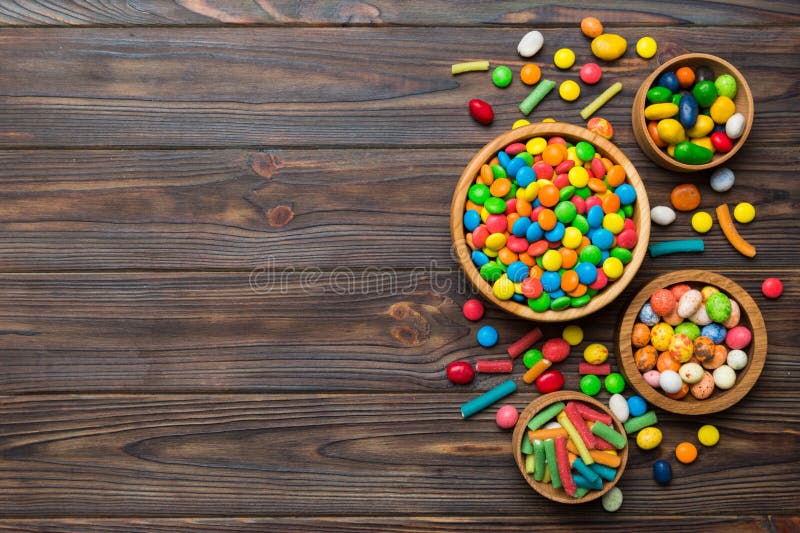 Different Colored Round Candy in Bowl and Jars. Top View of Large ...