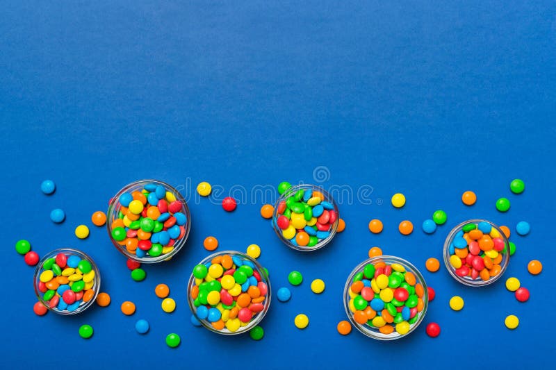 Different Colored Round Candy in Bowl and Jars. Top View of Large ...