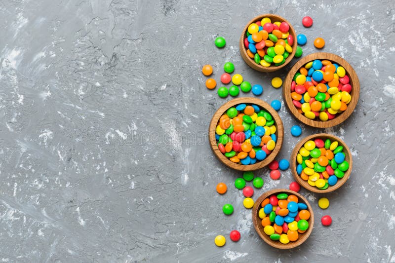Different Colored Round Candy in Bowl and Jars. Top View of Large ...