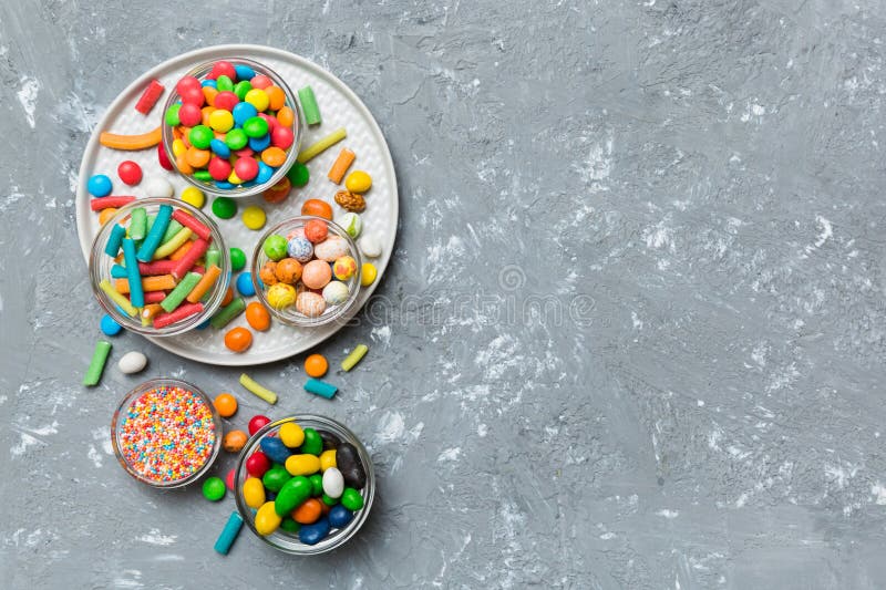 Different Colored Round Candy in Bowl and Jars. Top View of Large ...