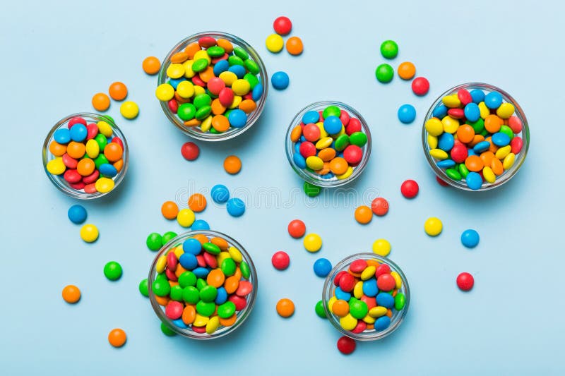 Different Colored Round Candy in Bowl and Jars. Top View of Large ...