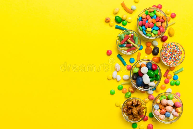 Different Colored Round Candy in Bowl and Jars. Top View of Large ...