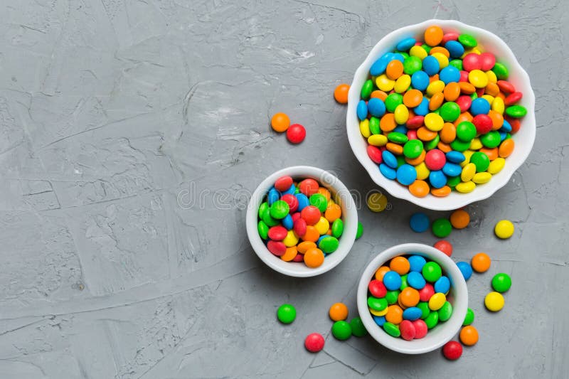 Different Colored Round Candy in Bowl and Jars. Top View of Large ...