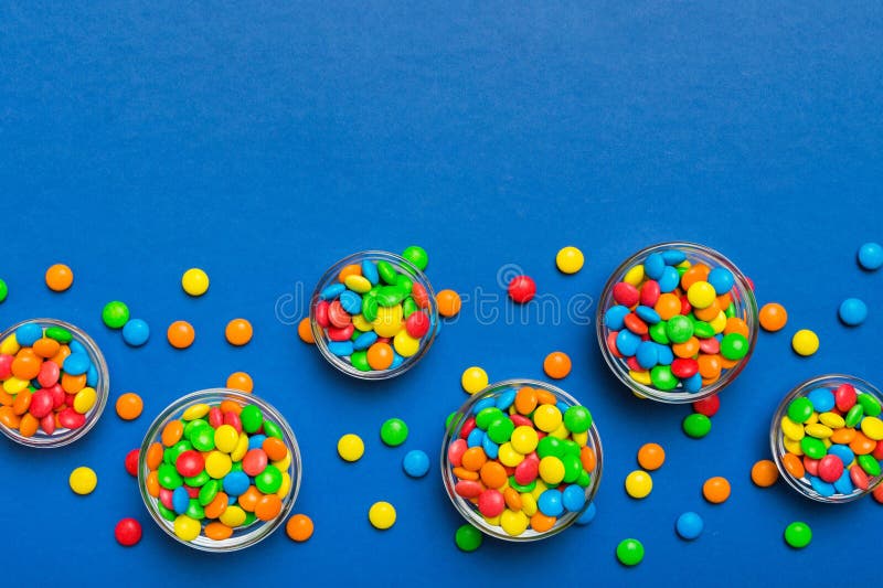 Different Colored Round Candy in Bowl and Jars. Top View of Large ...