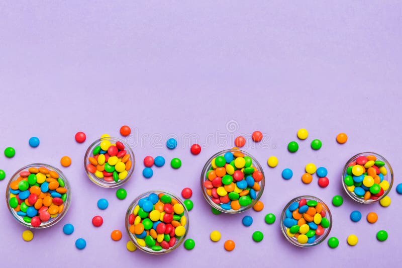 Different Colored Round Candy in Bowl and Jars. Top View of Large ...