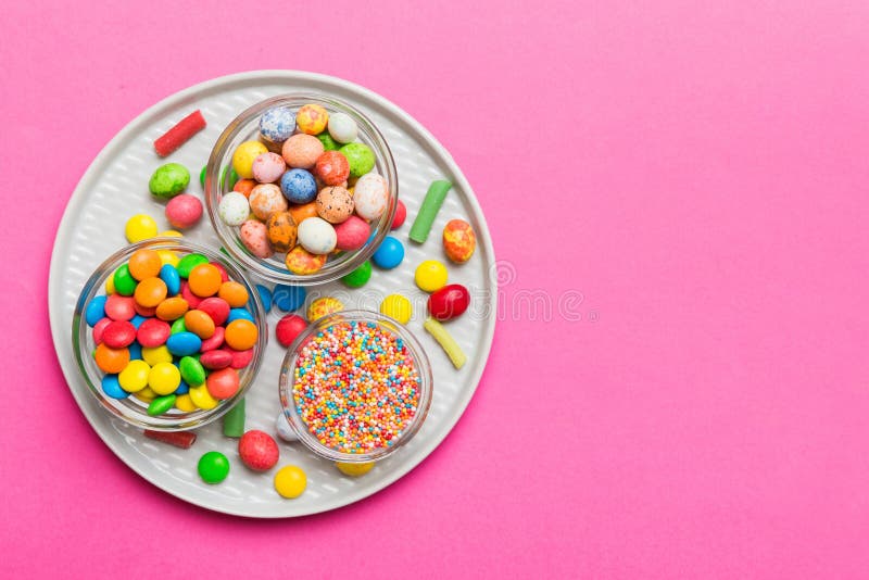 Different Colored Round Candy in Bowl and Jars. Top View of Large ...