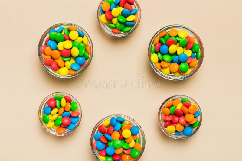 Different Colored Round Candy in Bowl and Jars. Top View of Large ...