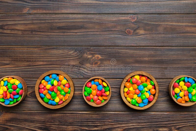 Different Colored Round Candy in Bowl and Jars. Top View of Large ...