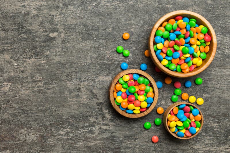 Different Colored Round Candy in Bowl and Jars. Top View of Large ...