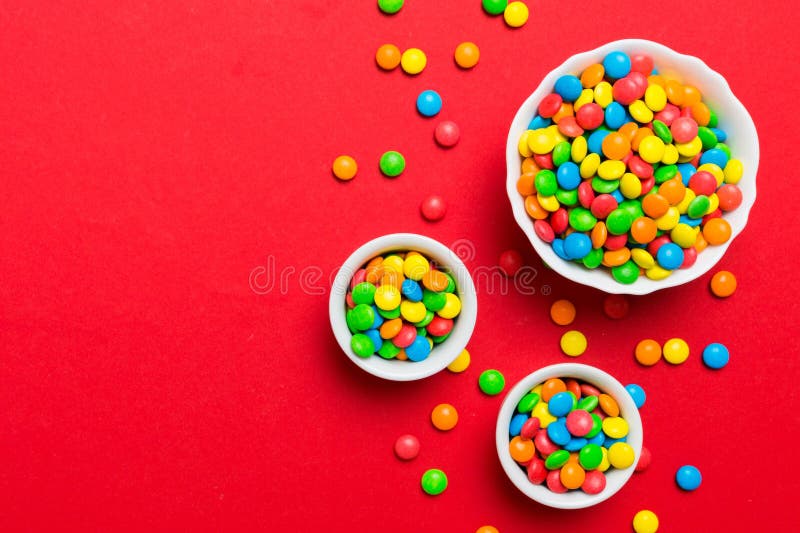 Different Colored Round Candy in Bowl and Jars. Top View of Large ...
