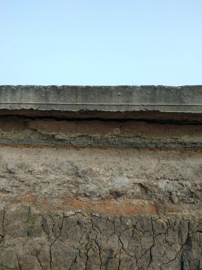 Different Colored Soil Layers Have Cracks Under the Concrete Road ...