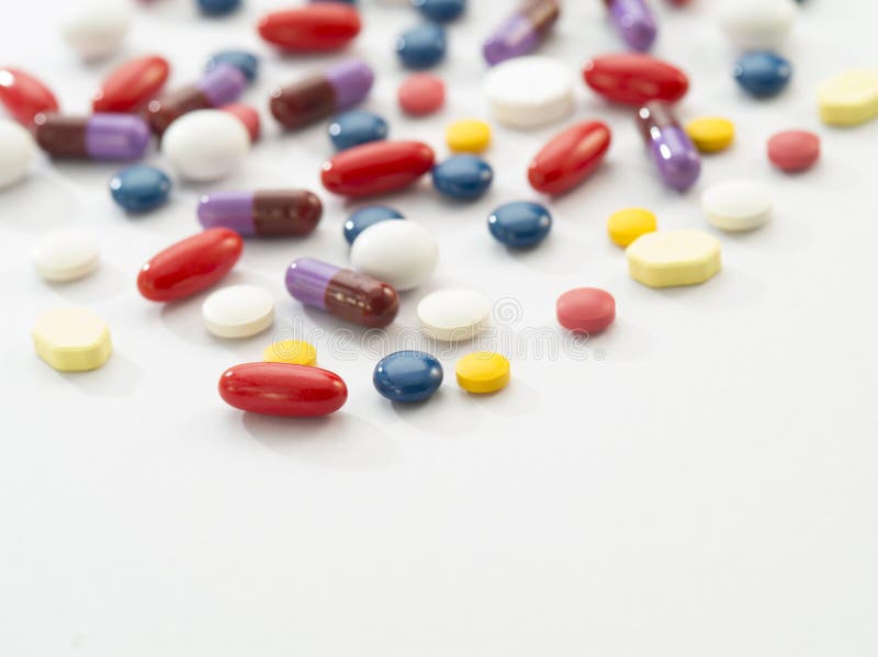 Of Different Colors Pills on White Back Stock Photo - Image of ...