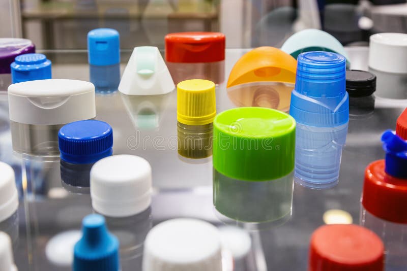 Different Colors of Plastic Lids and Containers of Different Shapes and ...