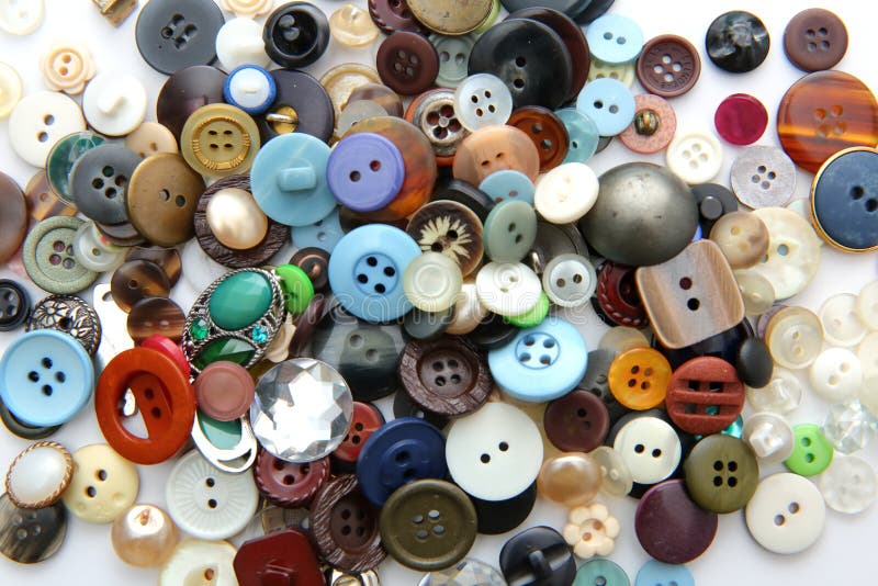 Different Colors and Shapes of Plastic Buttons Scattered on the Table ...