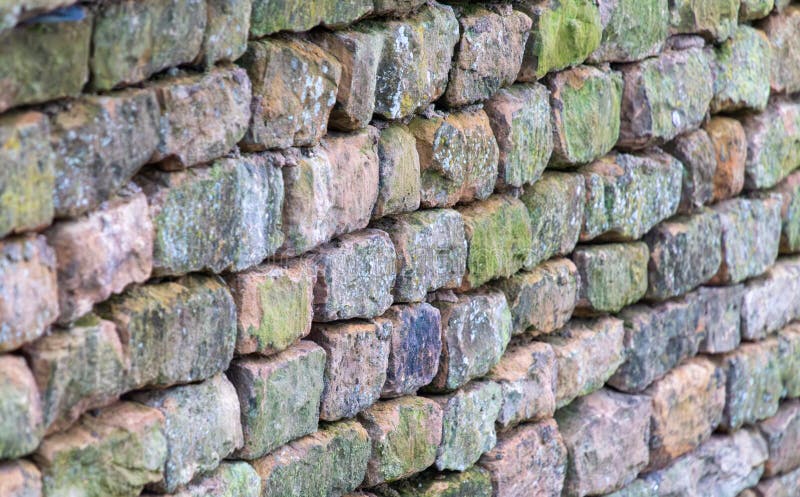 Bricks in dry stone wall stock photo. Image of wall - 338044314
