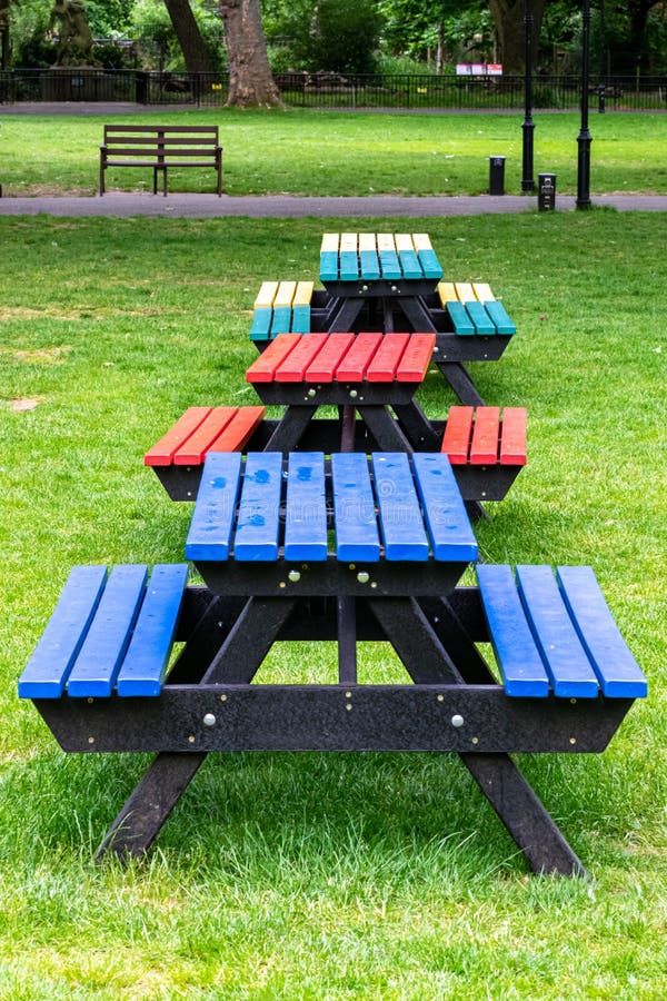 Different Coloured Tables and Seats in a Park Stock Photo - Image of ...