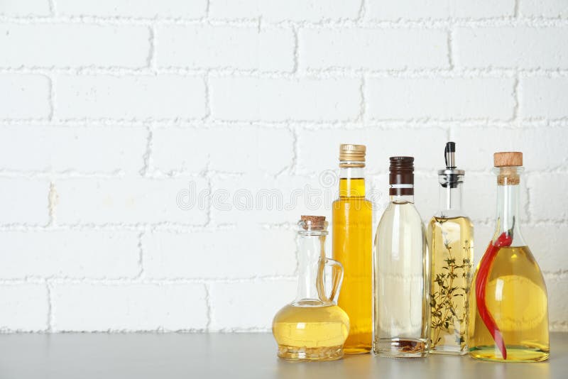 Different Cooking Oils on Table. Space for Text Stock Image - Image of ...