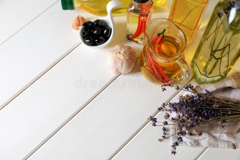 Different Cooking Oils and Ingredients on White Wooden Table, Above ...