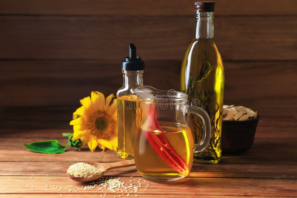 Different Cooking Oils and Ingredients on Wooden Table Stock Photo ...