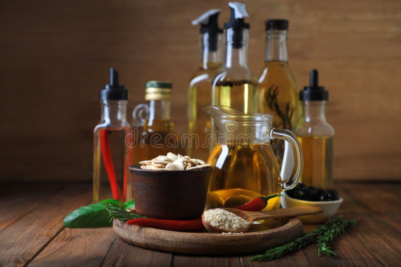 Different Cooking Oils and Ingredients on Wooden Table Stock Photo ...