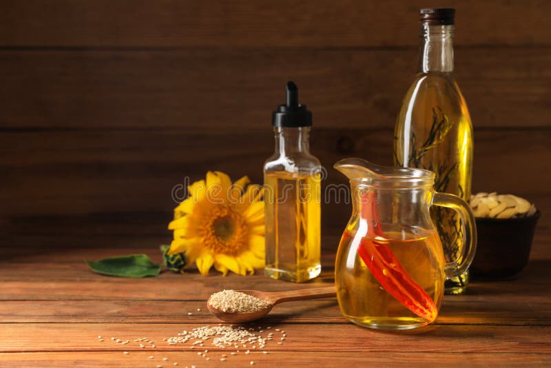 Different Cooking Oils and Ingredients on Wooden Table. Space for Text ...