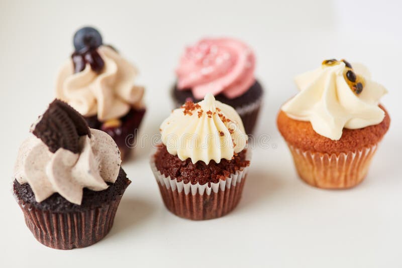 Different Cupcakes with Different Toppings Stock Image - Image of ...