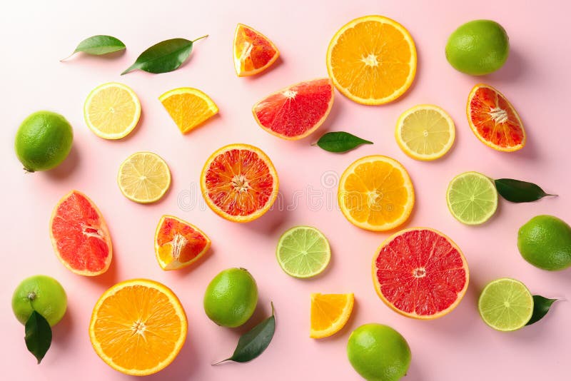 Different Cut Citrus Fruits on Color Background, Top View Stock Photo ...