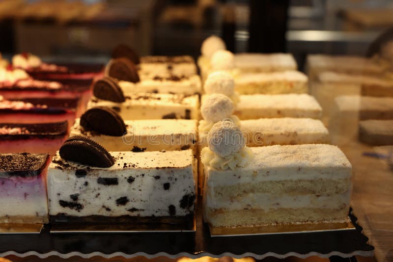 Different Delicious Cakes on Counter in Bakery Shop, Closeup Stock ...