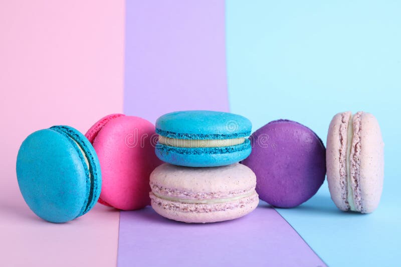 Different Delicious Fresh Macarons on Color Background Stock Image ...